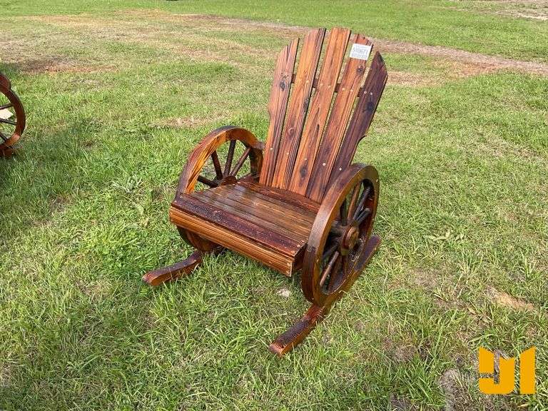 WOODEN WAGON WHEEL ROCKING CHAIR - Jeff Martin Auctioneers, Inc.