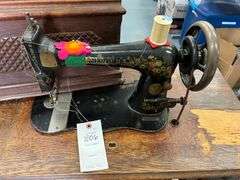 Singer Foot treadle sewing machine - Kessler Auction & Realty Co., INC.
