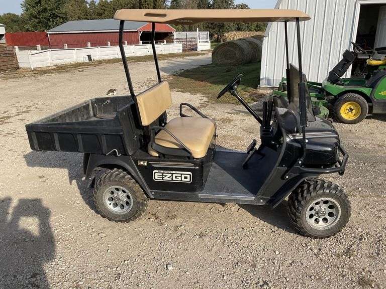2011 E-Z-GO gas Utility vehicle With manual dump - Legacy Auction Company