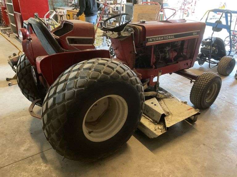 184 International cub lowboy, 60 in. deck, needs - Legacy Auction Company