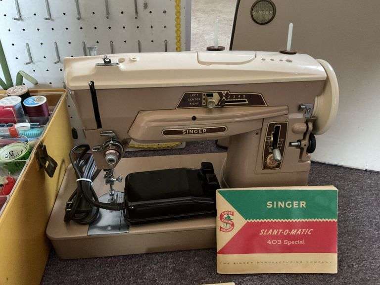 Singer sewing machine and sewing items - Legacy Auction Company