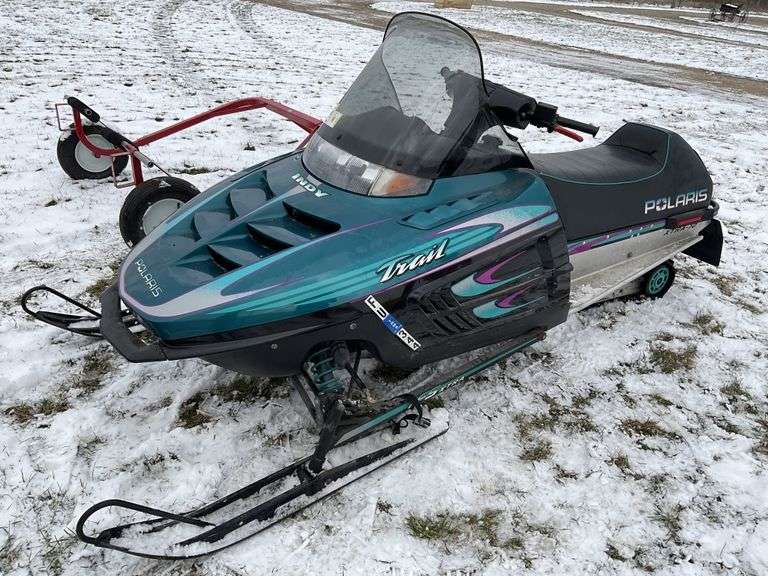 1997 Polaris Indy Trail 1466 miles, ran three - Legacy Auction Company