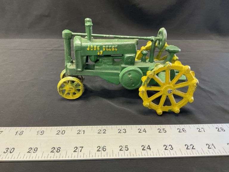 John Deere cast iron tractor - Legacy Auction Company