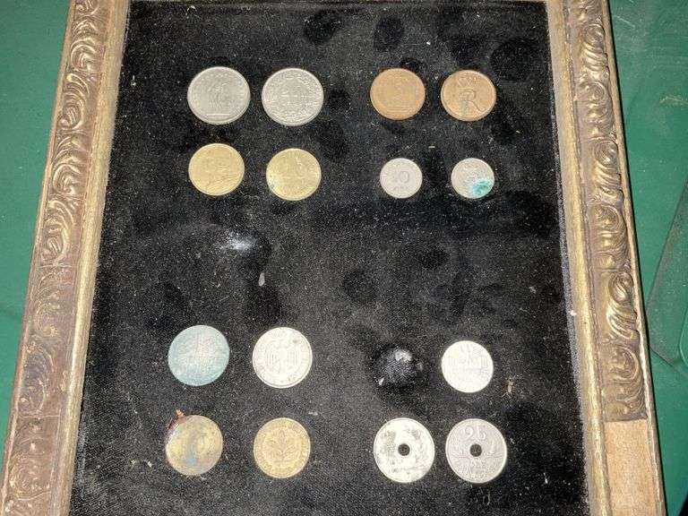 Foreign coins and bird sculpture - Legacy Auction Company