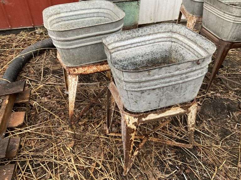 Two wash tubs on stands, stands are rusty - Legacy Auction Company