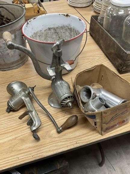 Meat grinders and enamel pail - Legacy Auction Company