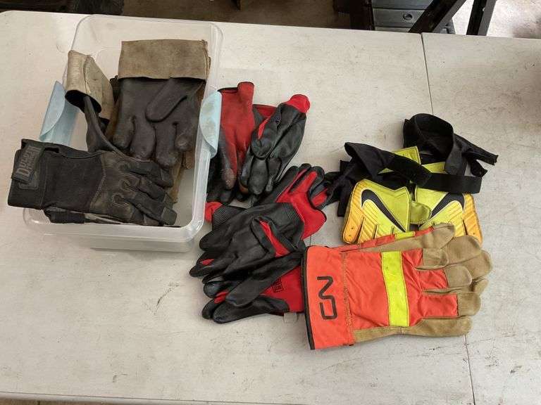 Assorted new and used Gloves - Legacy Auction Company