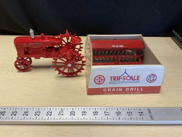 McCormick Farmall M and Tru-Scale grain drill - Legacy Auction Company