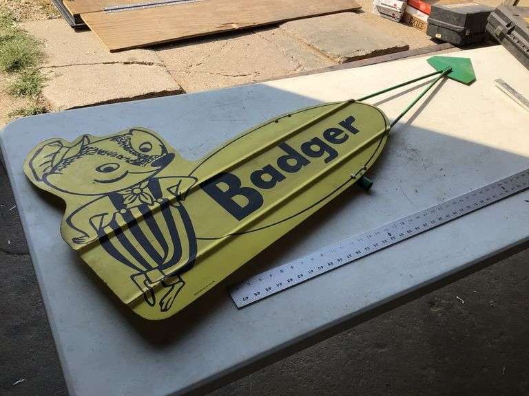 Vintage new metal double sided badger sign - Legacy Auction Company