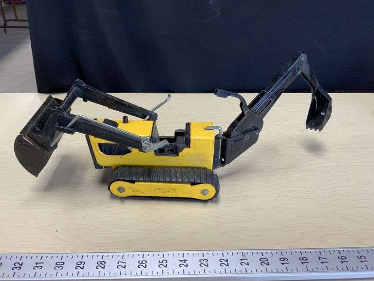 Tonka track loader backhoe - Legacy Auction Company