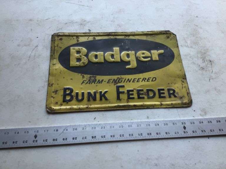 Vintage Metal badger sign - Legacy Auction Company