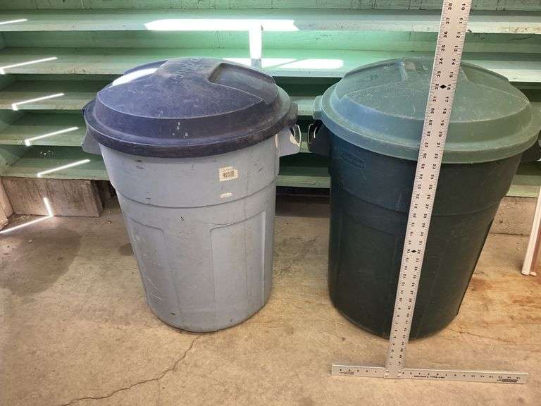 Two Rubbermaid garbage cans - Legacy Auction Company