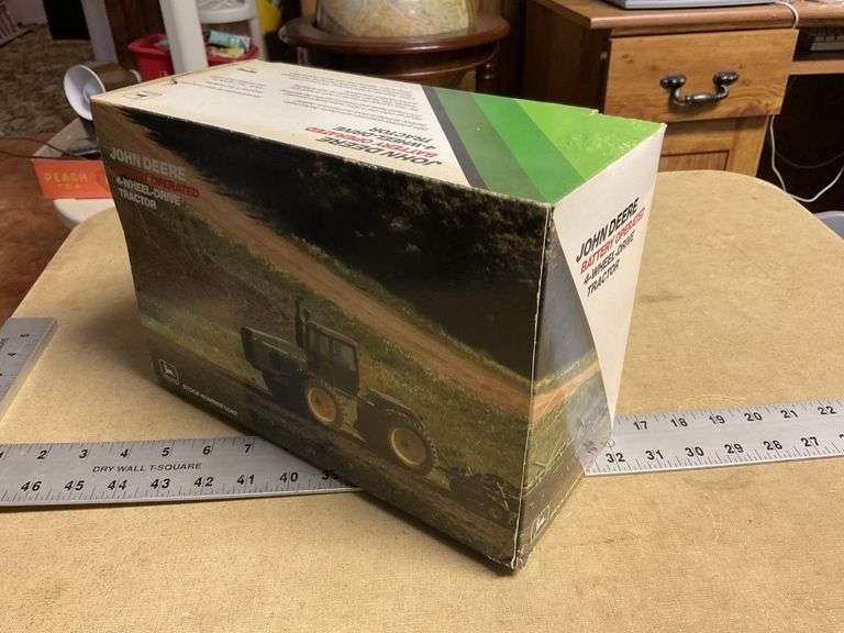 John Deere battery operated tractor - Legacy Auction Company