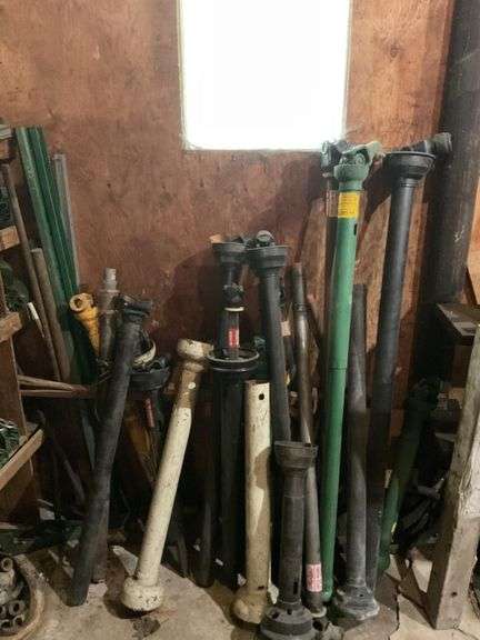 Iron and PTO shaft in rack - Legacy Auction Company