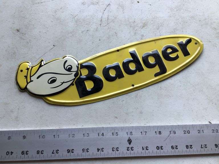 Vintage metal badger sign - Legacy Auction Company
