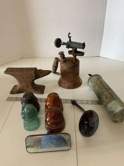 Rusty blow torch, anvil and insulators - Legacy Auction Company