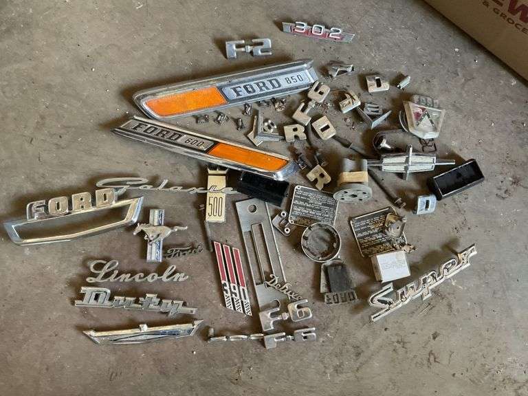 Assorted Ford emblems - Legacy Auction Company
