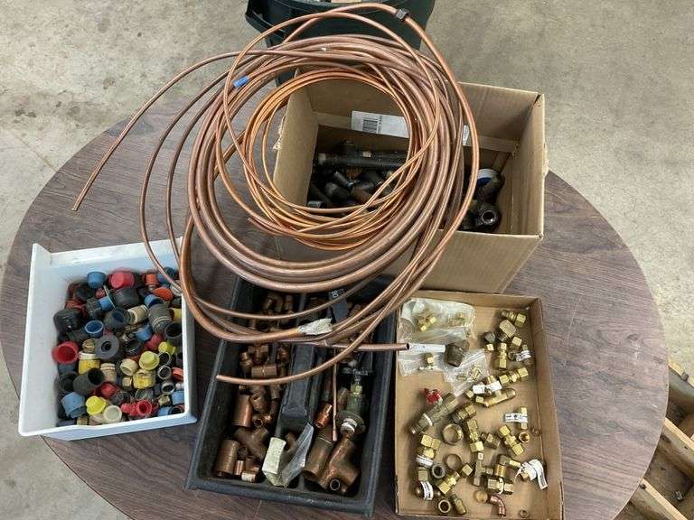 Assorted fittings, copper tubing and plugs - Legacy Auction Company