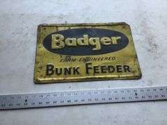 Vintage Metal badger sign - Legacy Auction Company