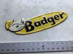 Vintage metal badger sign - Legacy Auction Company