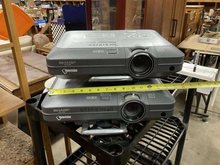 Sharp projectors, no cords - Legacy Auction Company