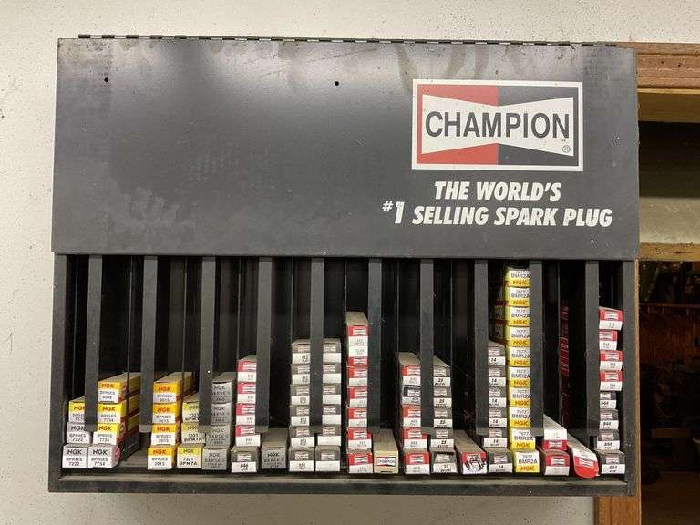 Champion spark plug display with spark plugs - Legacy Auction Company