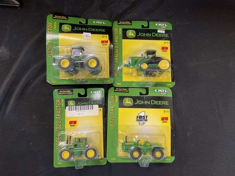 John Deere miniature tractor replicas - Legacy Auction Company