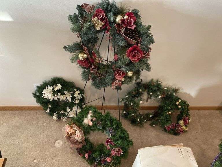 Five Christmas wreaths and wreath stand - Legacy Auction Company