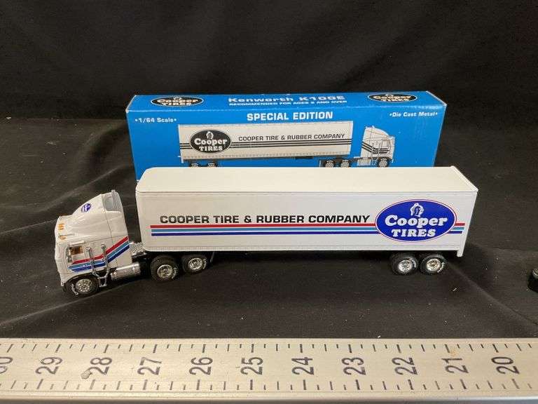 Kenworth K100E Cooper tire diecast coin bank - Legacy Auction Company