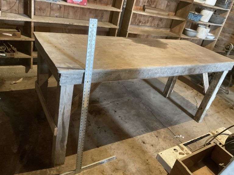 7’ x 32" wood shop table - Legacy Auction Company