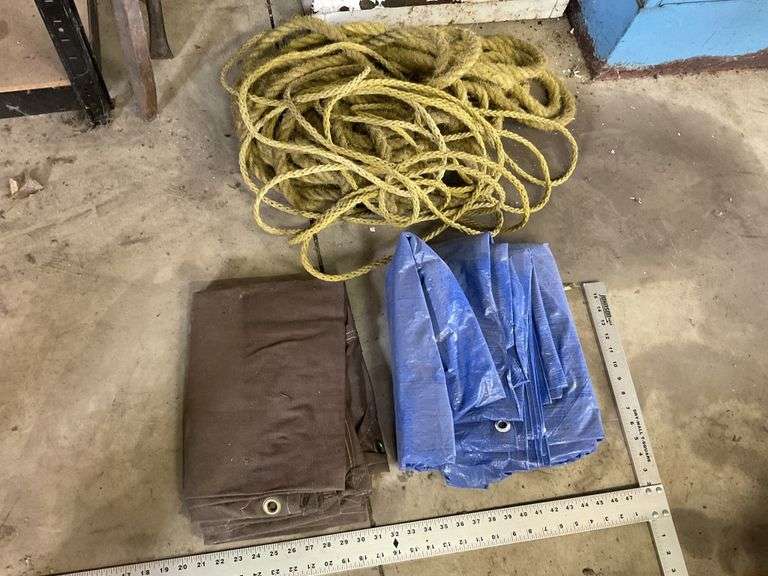 Tarps and ropes. One canvas tarp - Legacy Auction Company