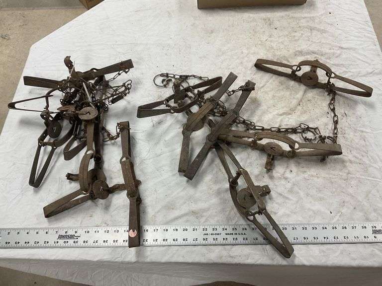 12 Assorted foot traps - Legacy Auction Company