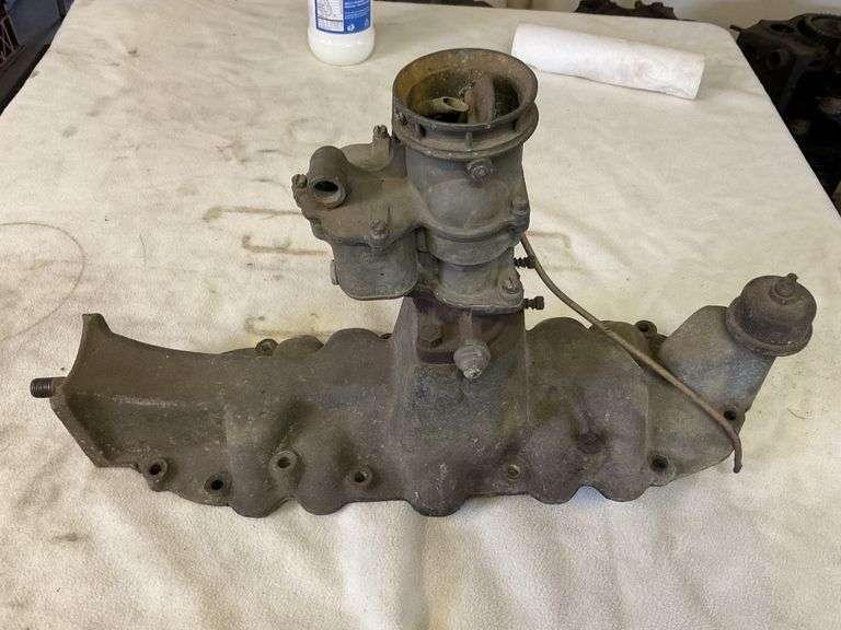 Ford flathead v8 2 barrel intake w/ carburetor - Legacy Auction Company