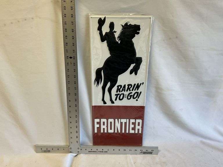 Embossed frontier sign - Legacy Auction Company