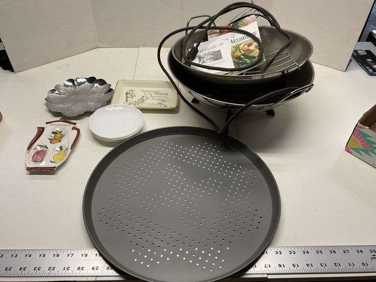 Wok, spoon rest, pizza pan, etc - Legacy Auction Company
