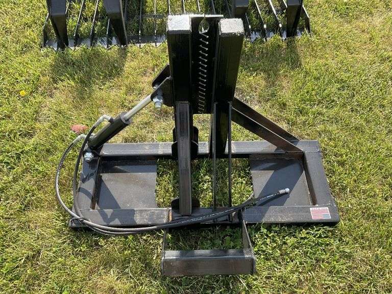 Skid loader hydraulic tree, puller attachment - Legacy Auction Company