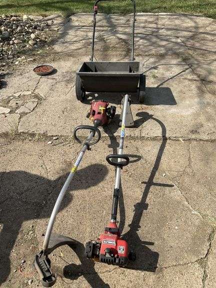 Two Homelite gas string trimmers and fertilizer - Legacy Auction Company