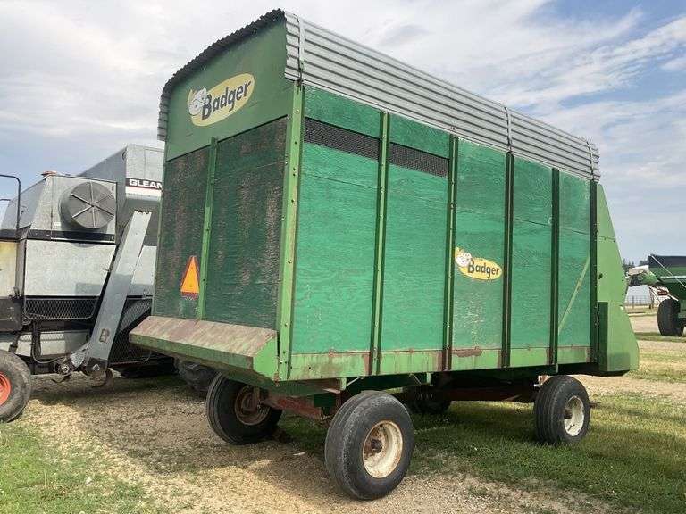 Badger 14’ wooden forage box on 12ton gears - Legacy Auction Company