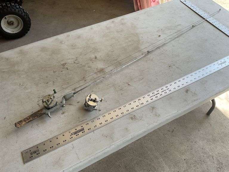 Vintage steel fishing rod and reels - Legacy Auction Company