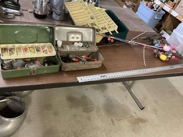 Fishing poles and tackle boxes - Legacy Auction Company