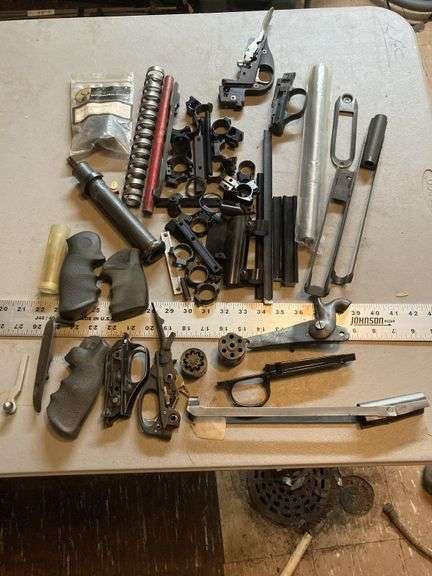 Assorted gun parts, cylinders, pistol grips, - Legacy Auction Company