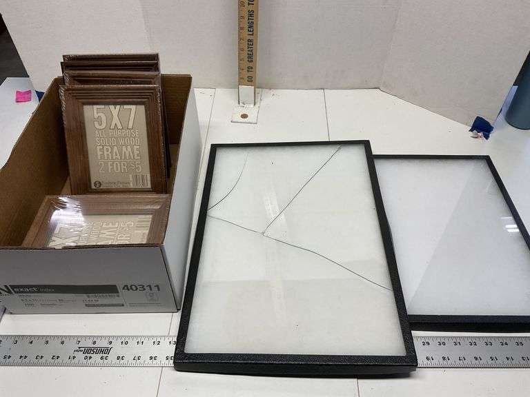 Picture frames, display cases – one broken glass - Legacy Auction Company