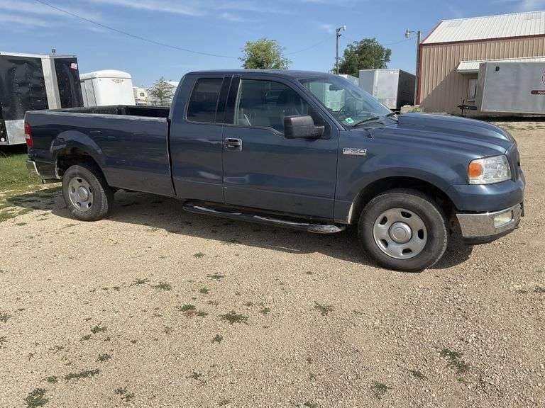 2004 blue F150 XLT 5.4 Triton pickup. Extended - Legacy Auction Company