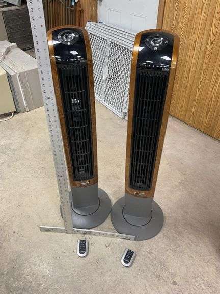 2 Lasko tower fans w/ remotes - Legacy Auction Company