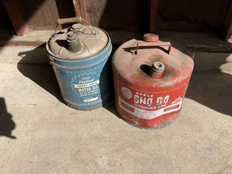2 Metal gas cans - Legacy Auction Company