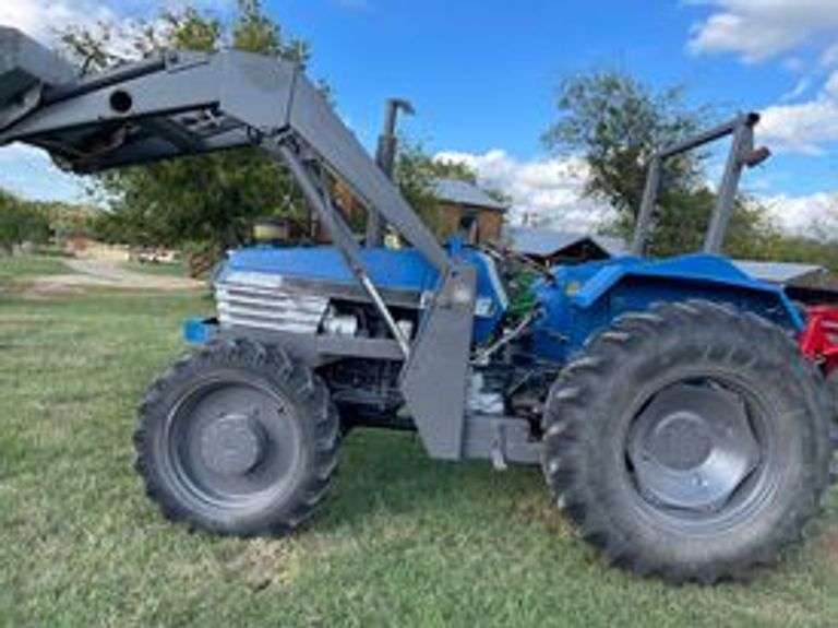 4x4 Long 2460 Tractor w/ loader - Leap Auctions, LLC