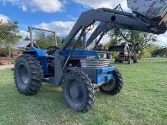 4x4 Long 2460 Tractor w/ loader - Leap Auctions, LLC