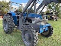 4x4 Long 2460 Tractor w/ loader - Leap Auctions, LLC