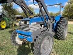 4x4 Long 2460 Tractor w/ loader - Leap Auctions, LLC