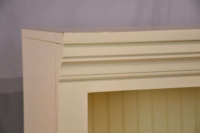 Cream colored open front bookcase; 74-7388 - R.H. Lee & Co. Auctioneers